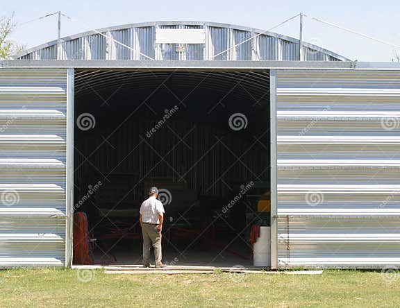 Man and metal building stock photo. Image of doorway, metal - 791078