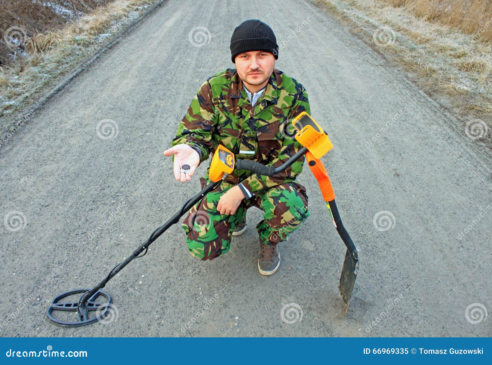 Man with metal detector . stock image. Image of lawn - 66969335