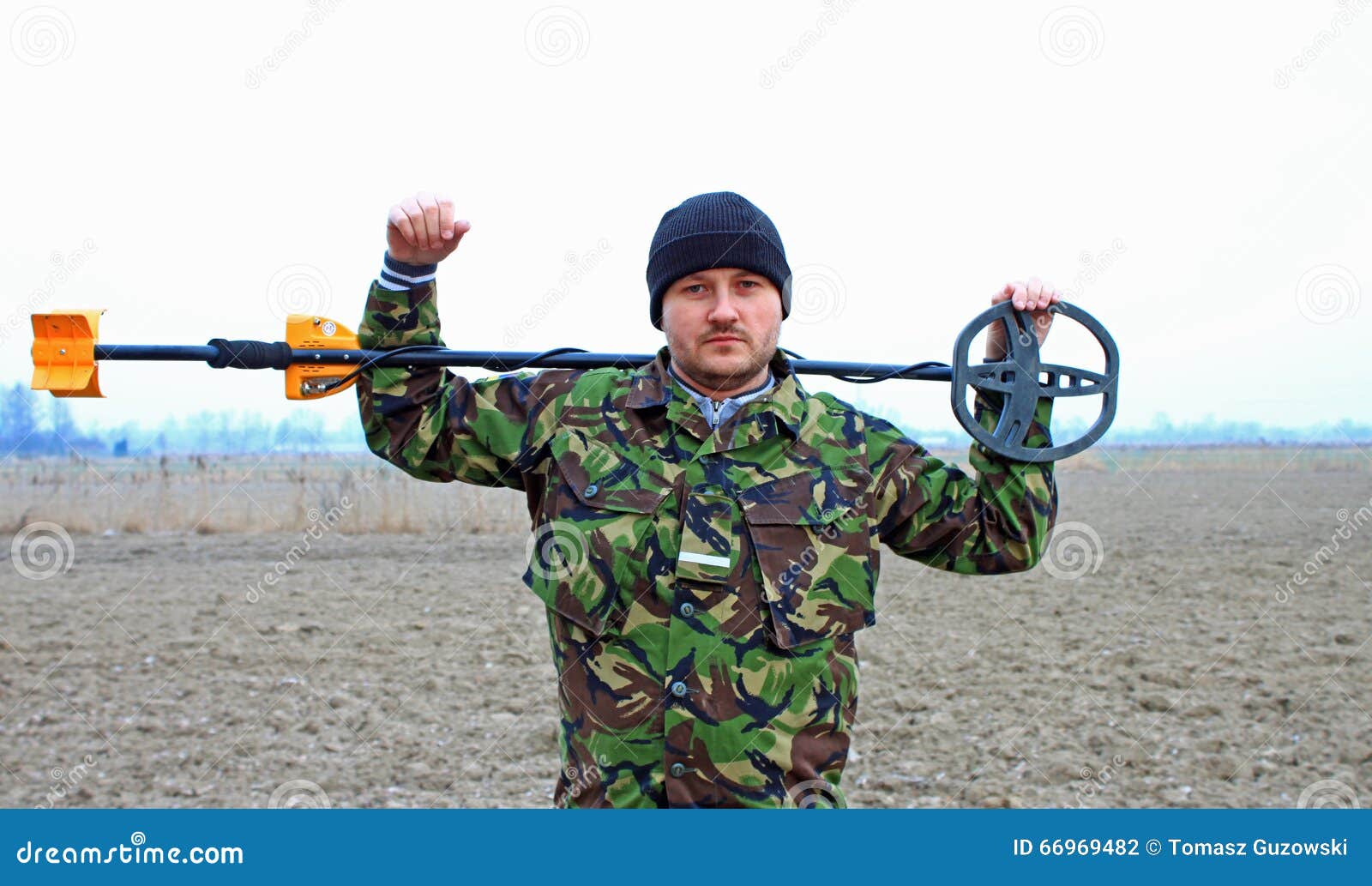 Man with metal detector . stock photo. Image of device - 66969482