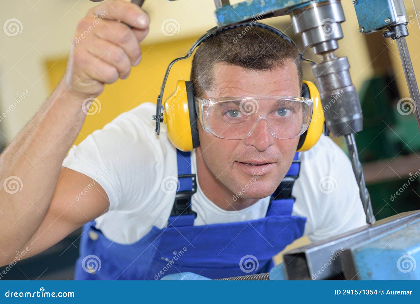 Man metal drilling work stock photo. Image of safeve - 291571354