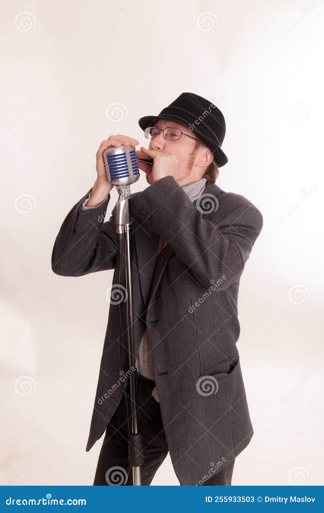 Man with a Microphone Playing the Harmonica Stock Image - Image of ...