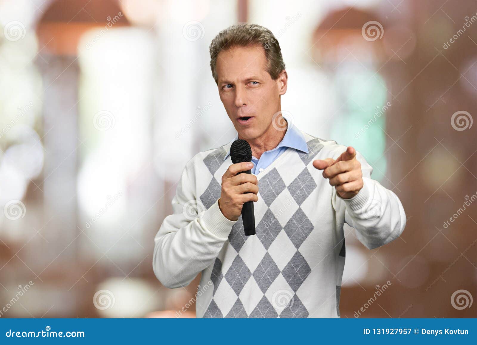 Man with Microphone Showing Forward with Finger. Stock Image - Image of ...