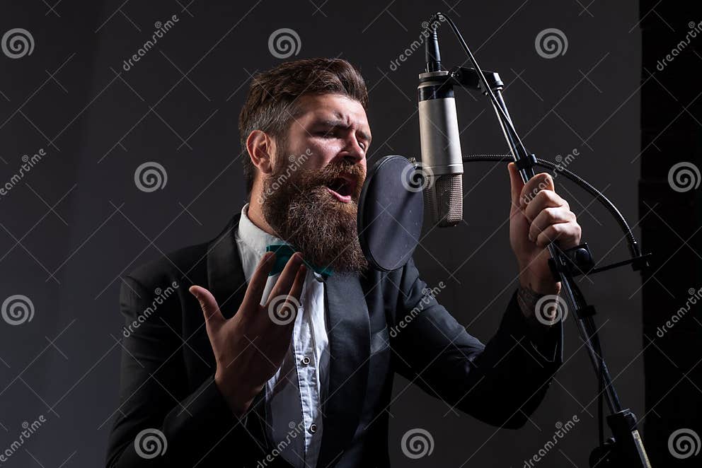 Man with Microphone Singing in Music Hall. Stock Image - Image of jazz ...