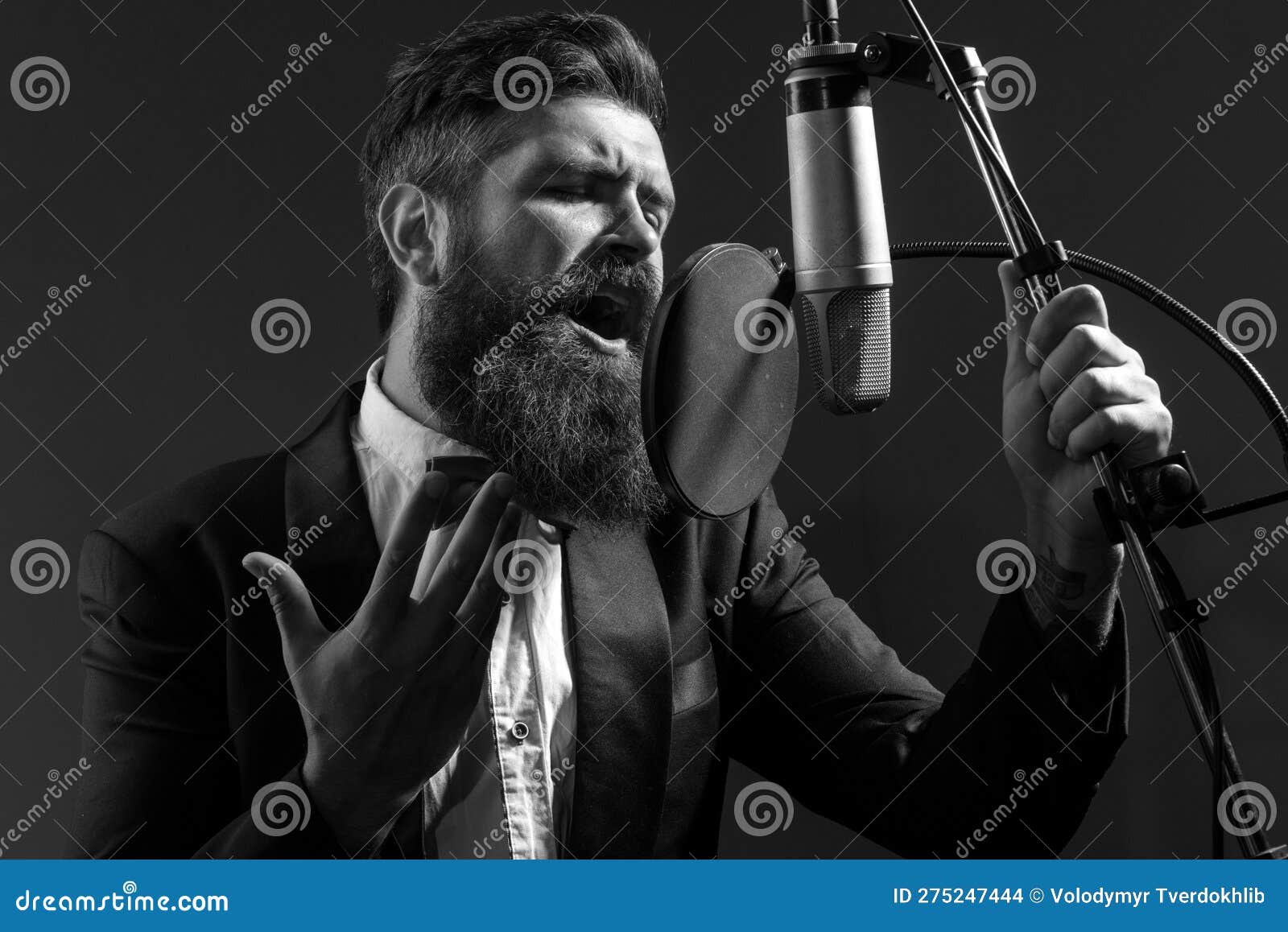 Man with Microphone Singing in Music Hall. Stock Photo - Image of ...