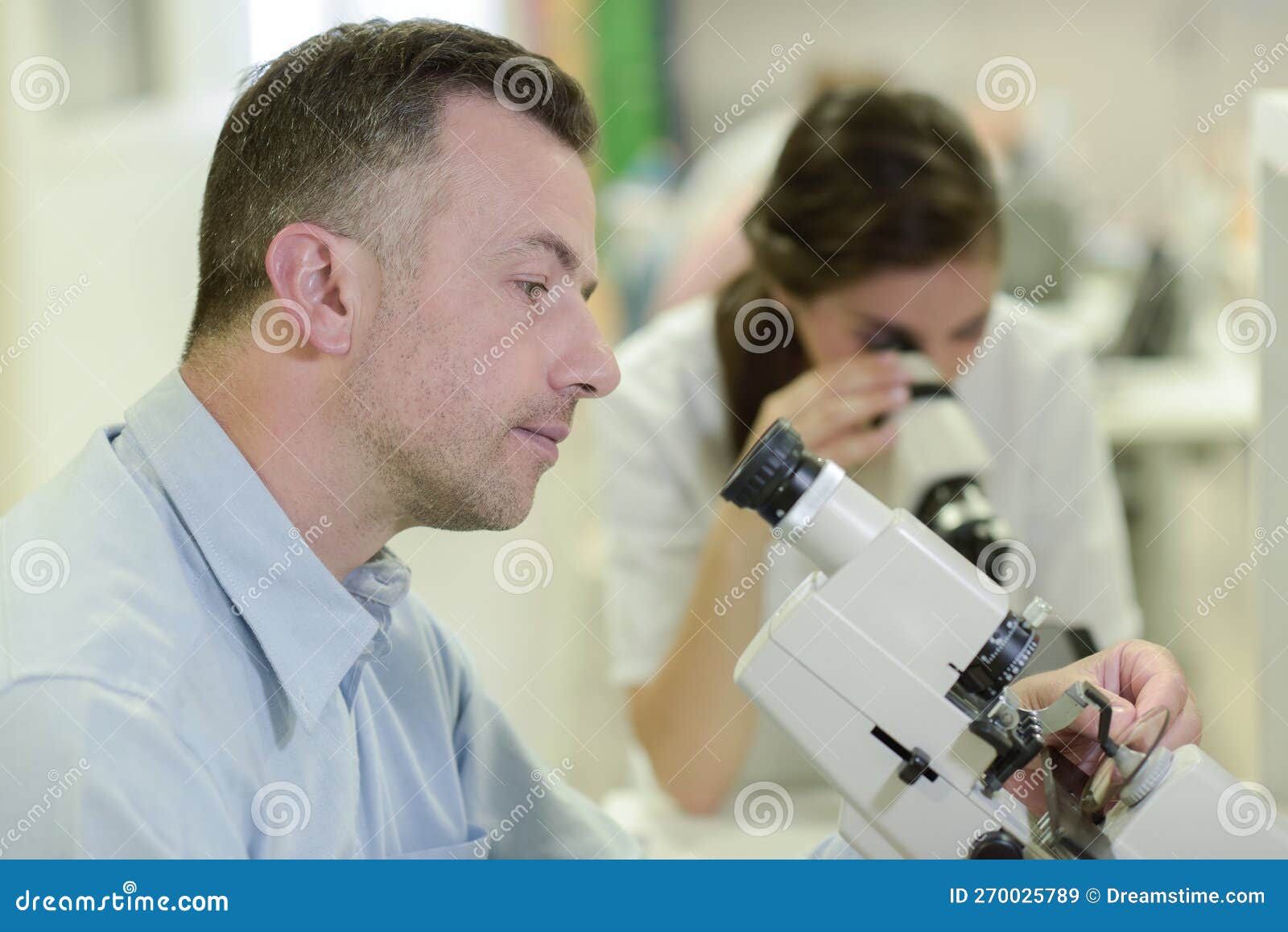 Man with microscope stock image. Image of background - 270025789
