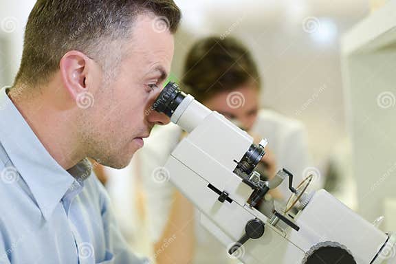 Man with Microscope in Lab at University Stock Image - Image of ...