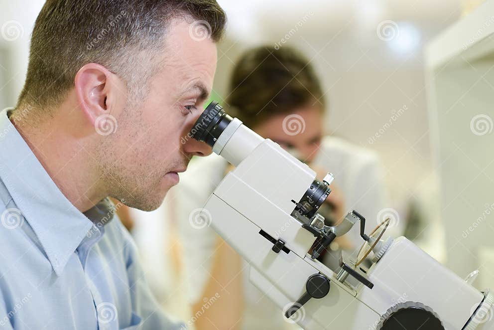 Man with Microscope in Lab at University Stock Image - Image of ...