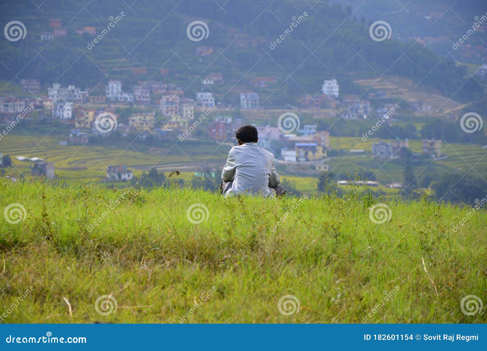 A Man Sitting Alone and Thinking about His Problems Stock Photo - Image ...