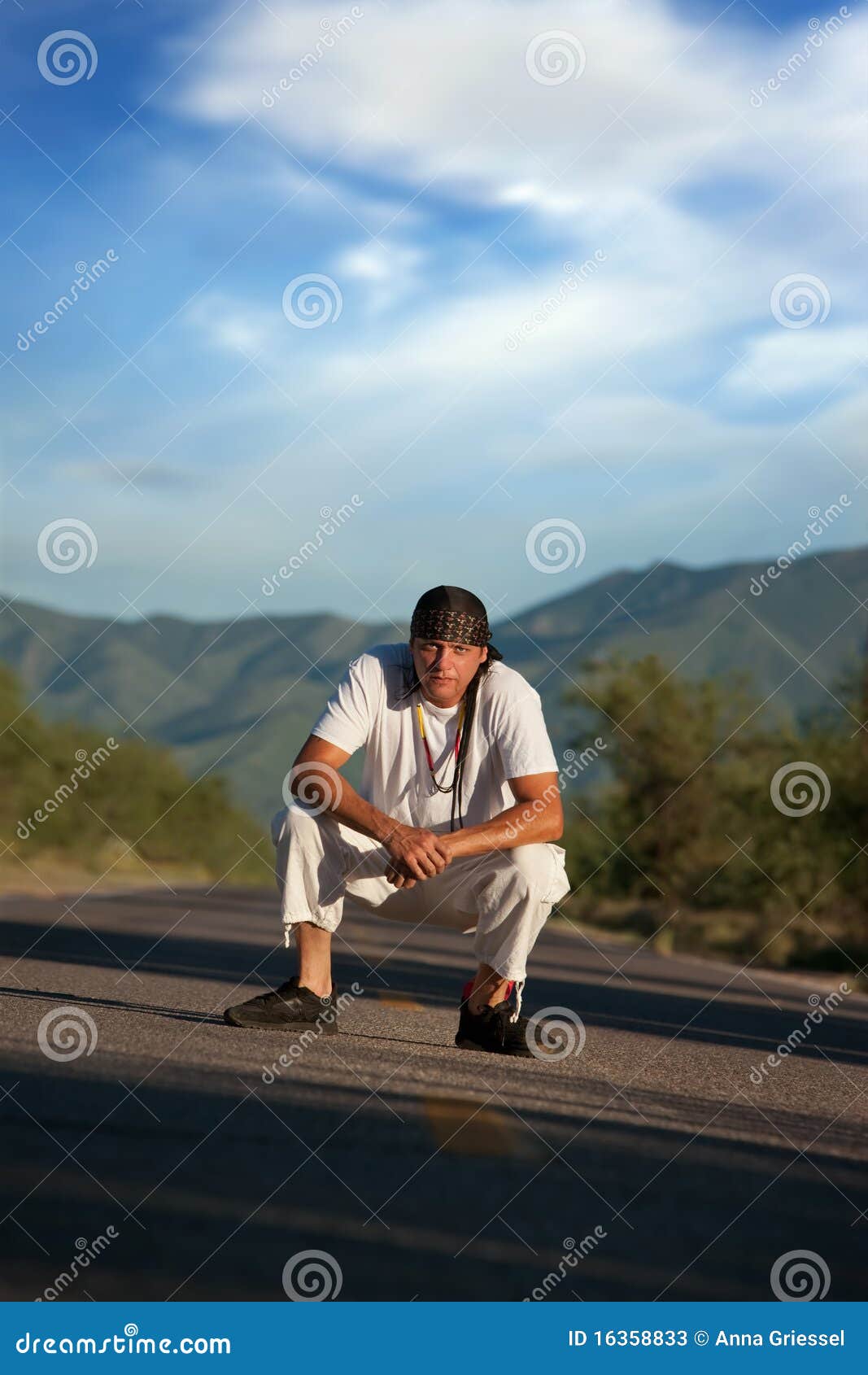 Man in the Middle of a Road Stock Image - Image of cowboy, squat: 16358833