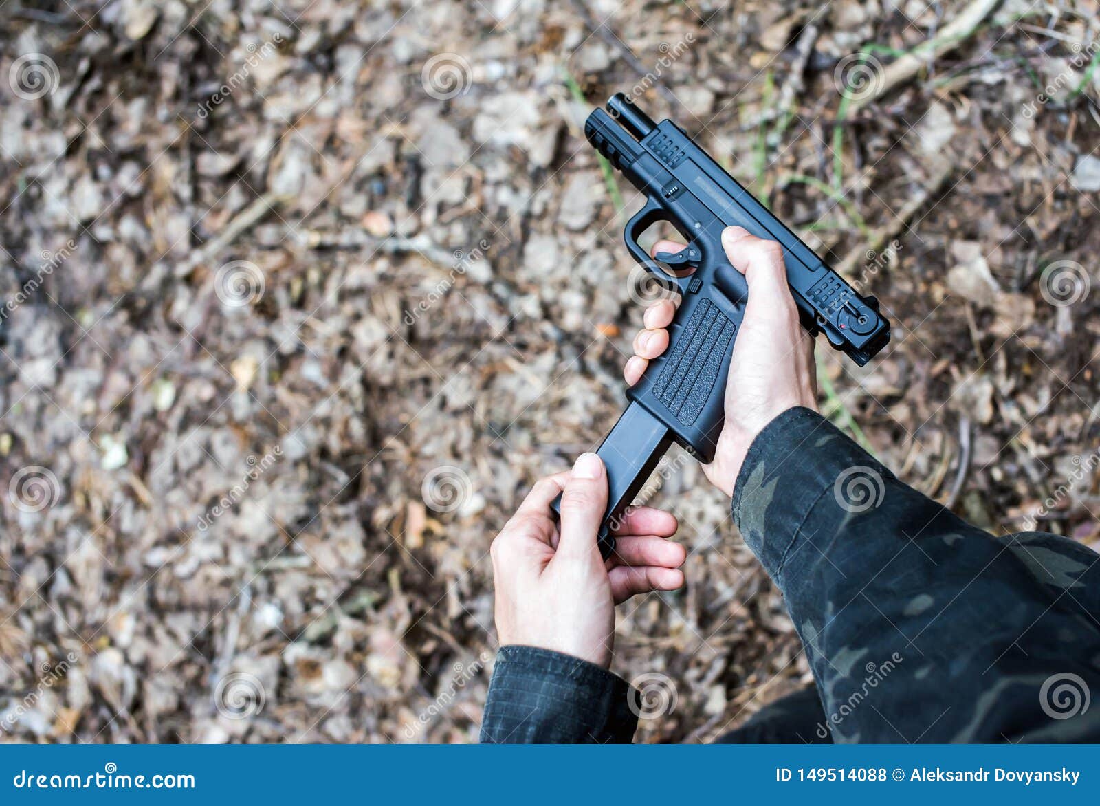 Man in Military Clothes Loading a Gun Stock Photo - Image of horizontal ...