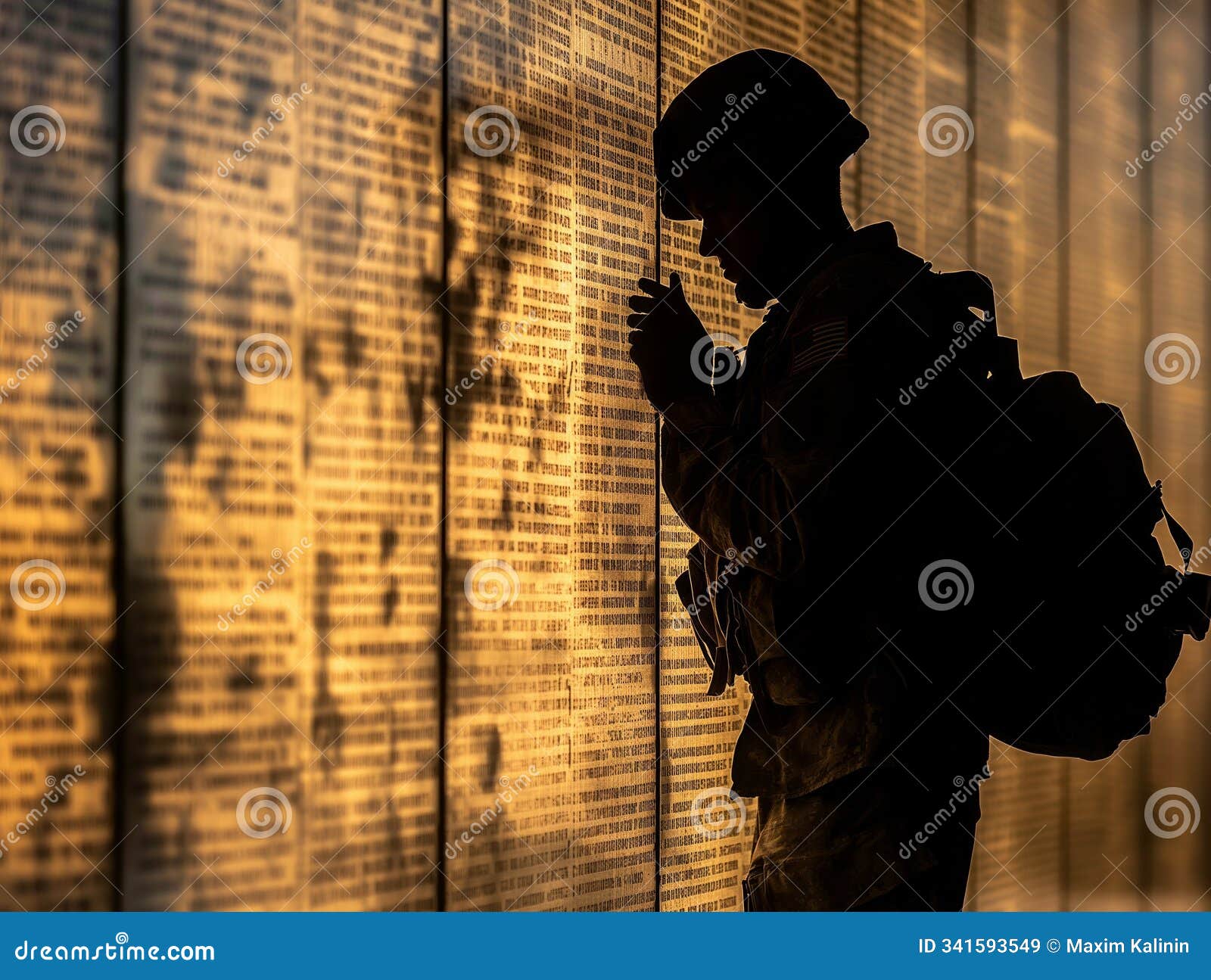 A Man in a Military Uniform is Standing in Front of a Wall of Names ...
