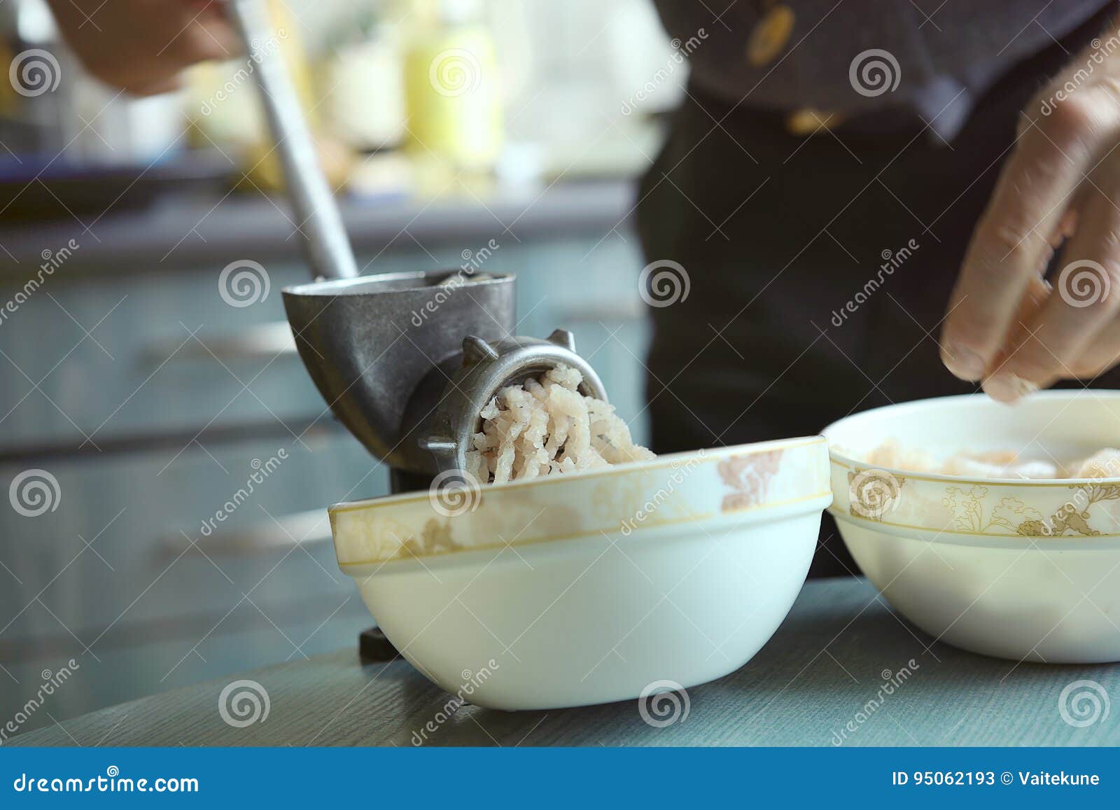 Man Mincing Fish with Grinder. Stock Image - Image of machine, table ...