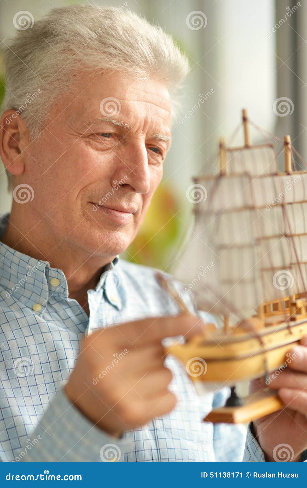 Man with miniature ship stock image. Image of people - 51138171