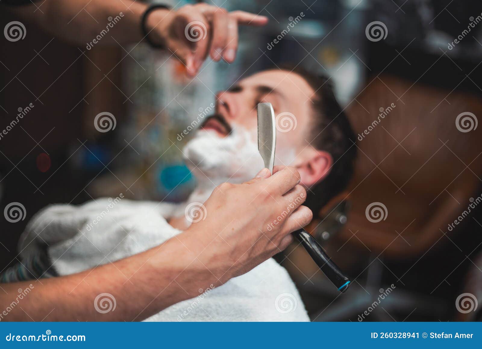 Man Mith Mustaches Having A Shave Razor In Hands Of Specialist Barber