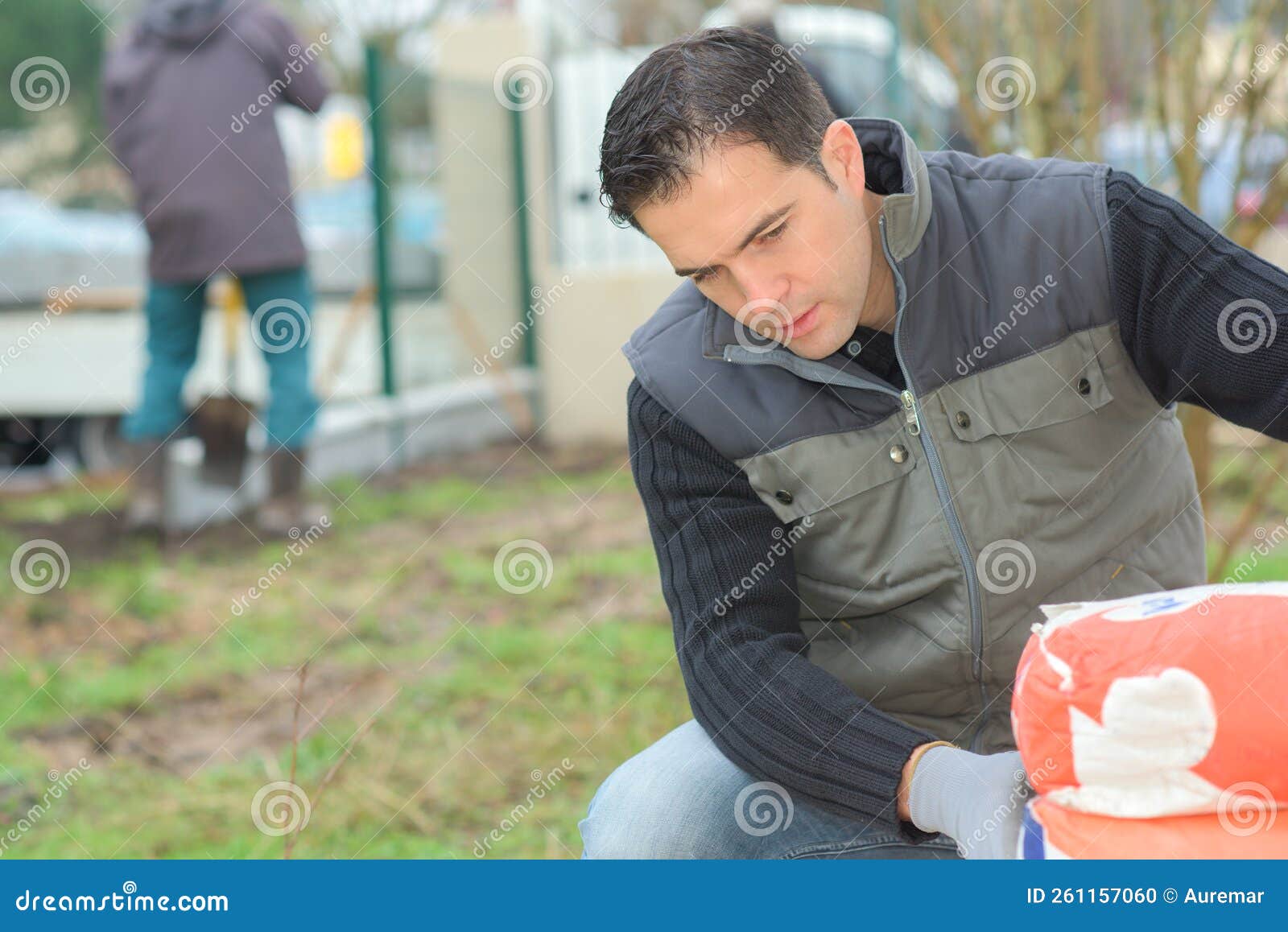 Man mixing cement stock photo. Image of vocational, fence - 261157060