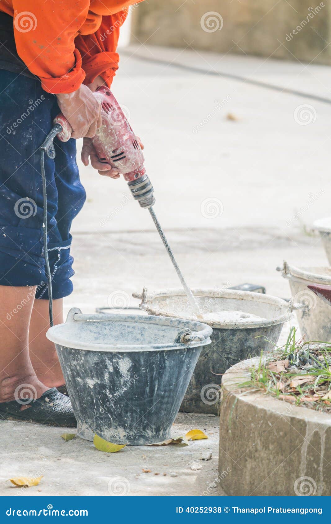A man mixing the concrete stock photo. Image of concrete - 40252938