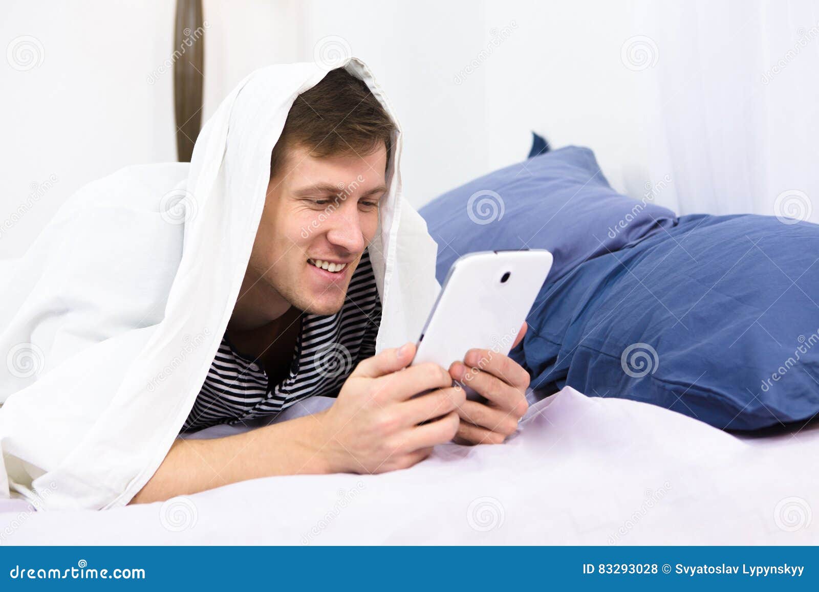 Man with Mobile Phone in Bed Stock Photo - Image of holding, life: 83293028