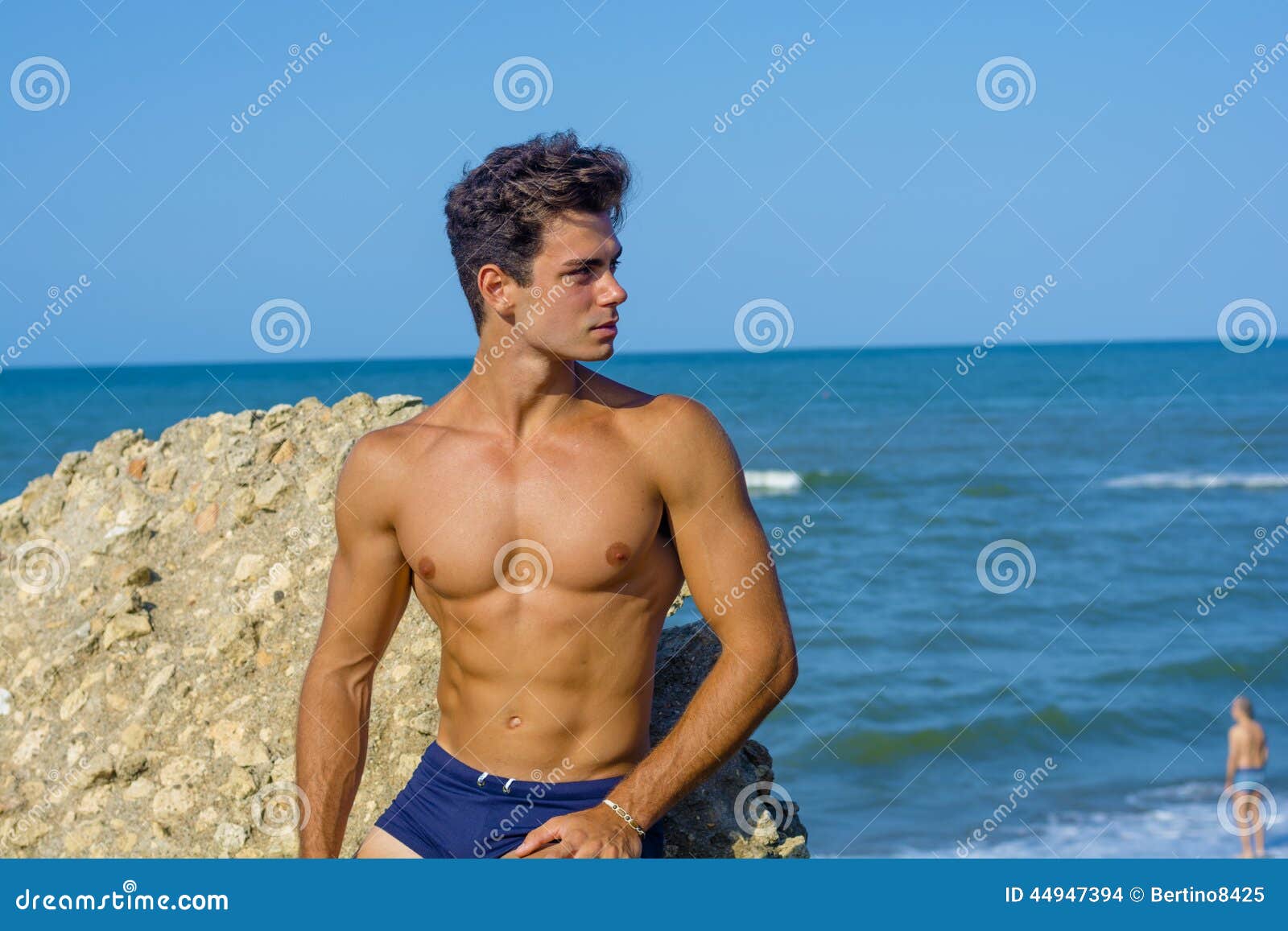 Man at the Beach with Defined Body Stock Photo - Image of rock, roma ...