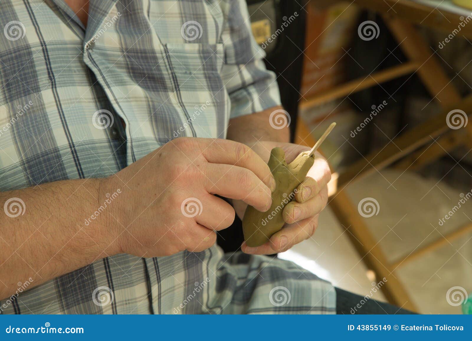 A Man is Modelling a Figurine from Clay Stock Image - Image of ...