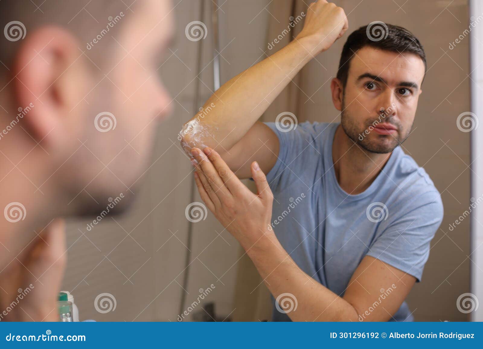 Man Moisturizing His Dry Elbows Stock Photo - Image of hold, eczema ...