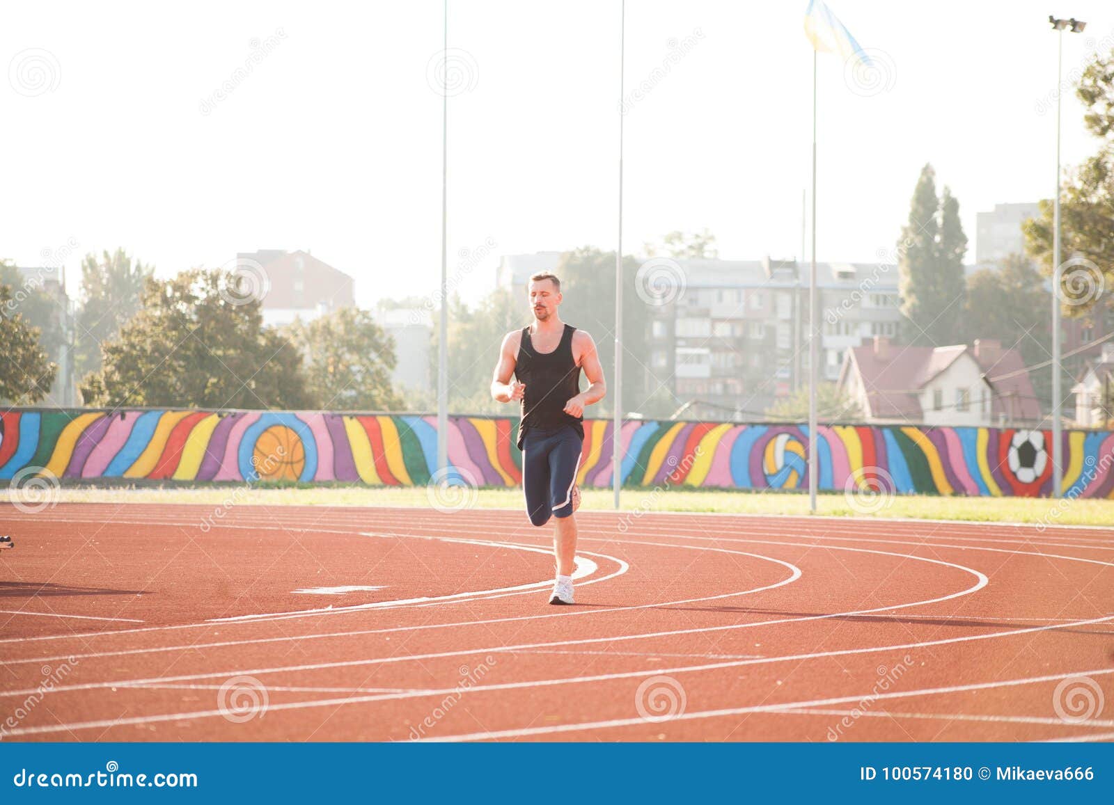 A Man on a Morning Run in the Stadium Stock Photo - Image of morning ...