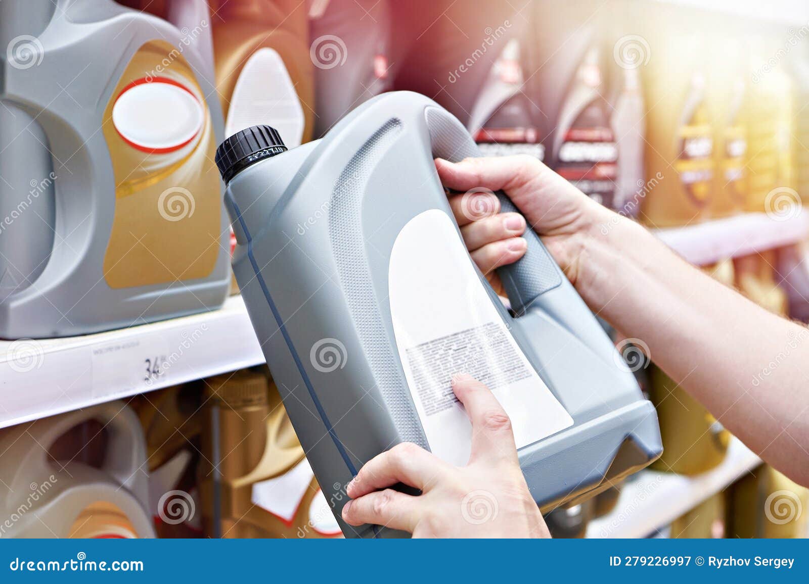 Man with Motor Oil in Store Stock Image - Image of mechanic, motor ...