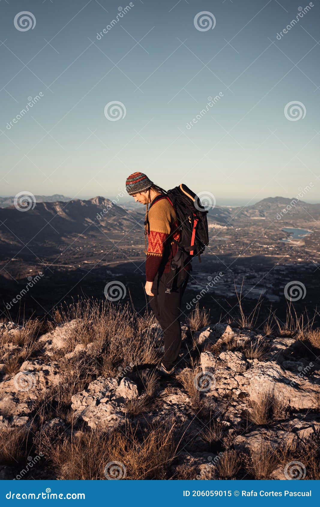 Man in the Mountain at Sunset. Guy Practicing Trekking Stock Image ...