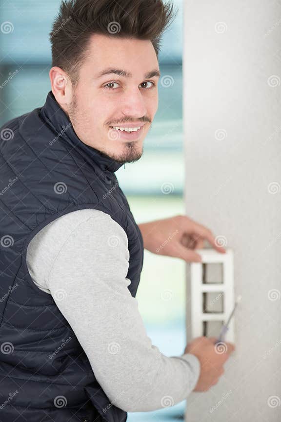 Man Mounting Light Switches To Wall Stock Photo - Image of electrician ...
