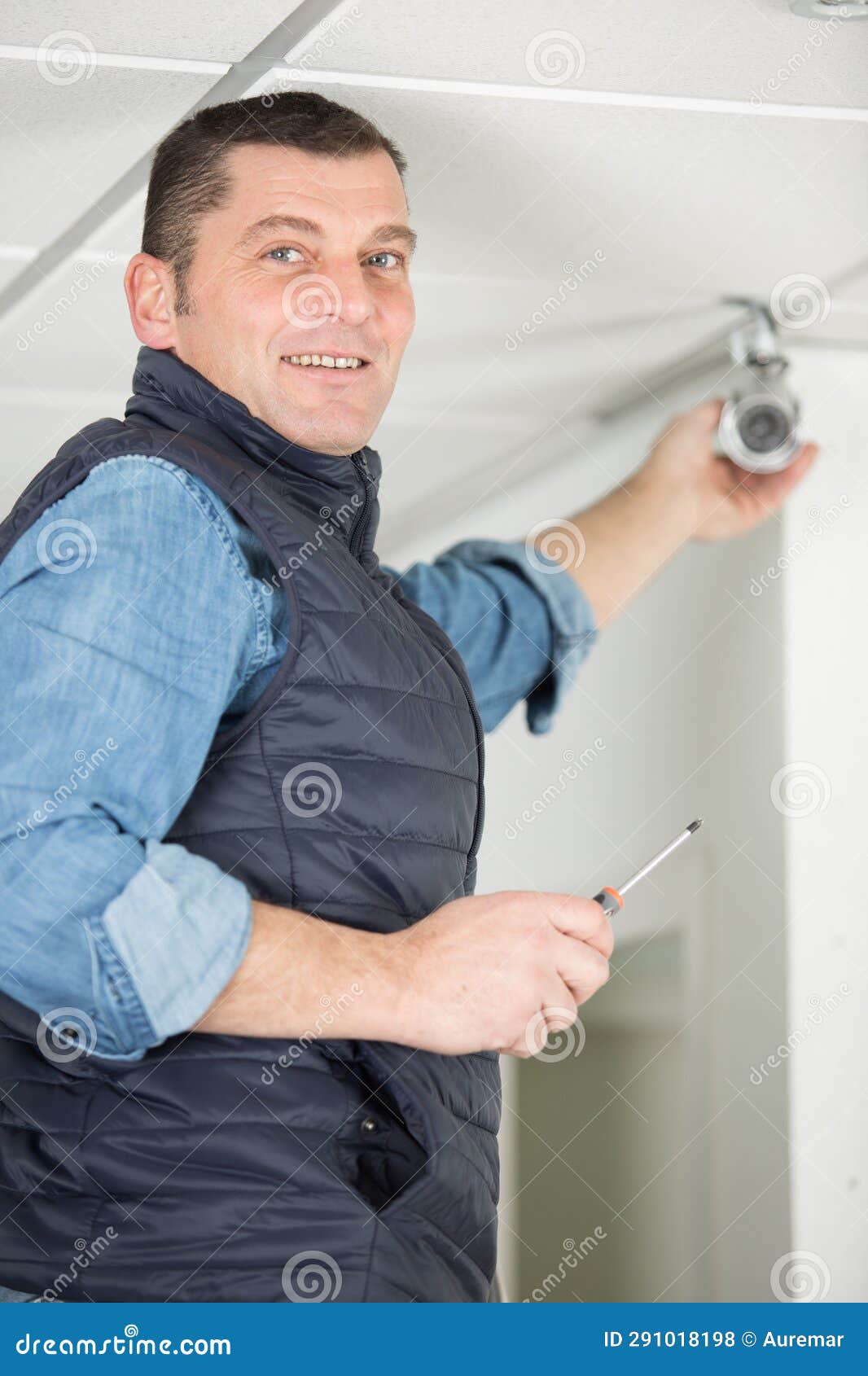 Man Mounting Security Camera To Ceiling Stock Photo - Image of mounting ...