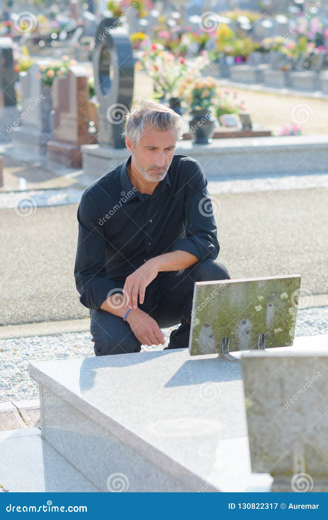 Man mourning at grave stock image. Image of family, mature - 130822317