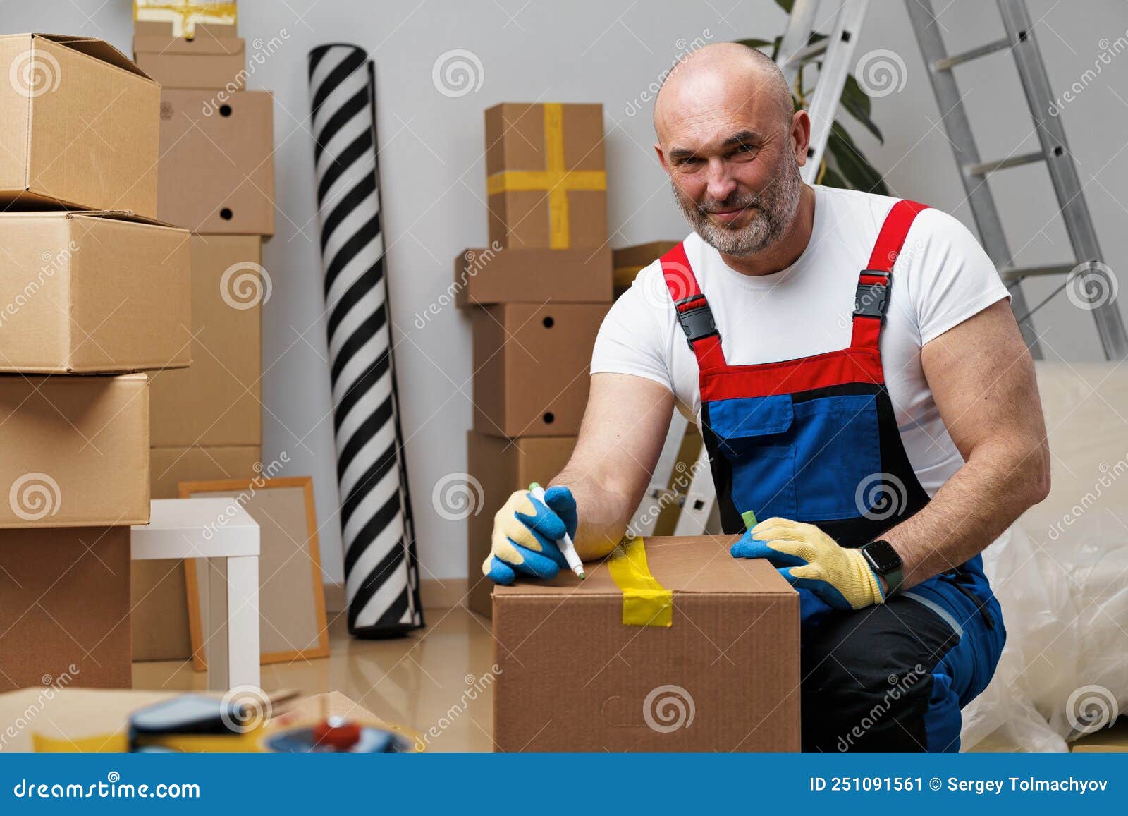 Man Mover in Uniform Packing Boxes for Relocation Stock Image - Image ...