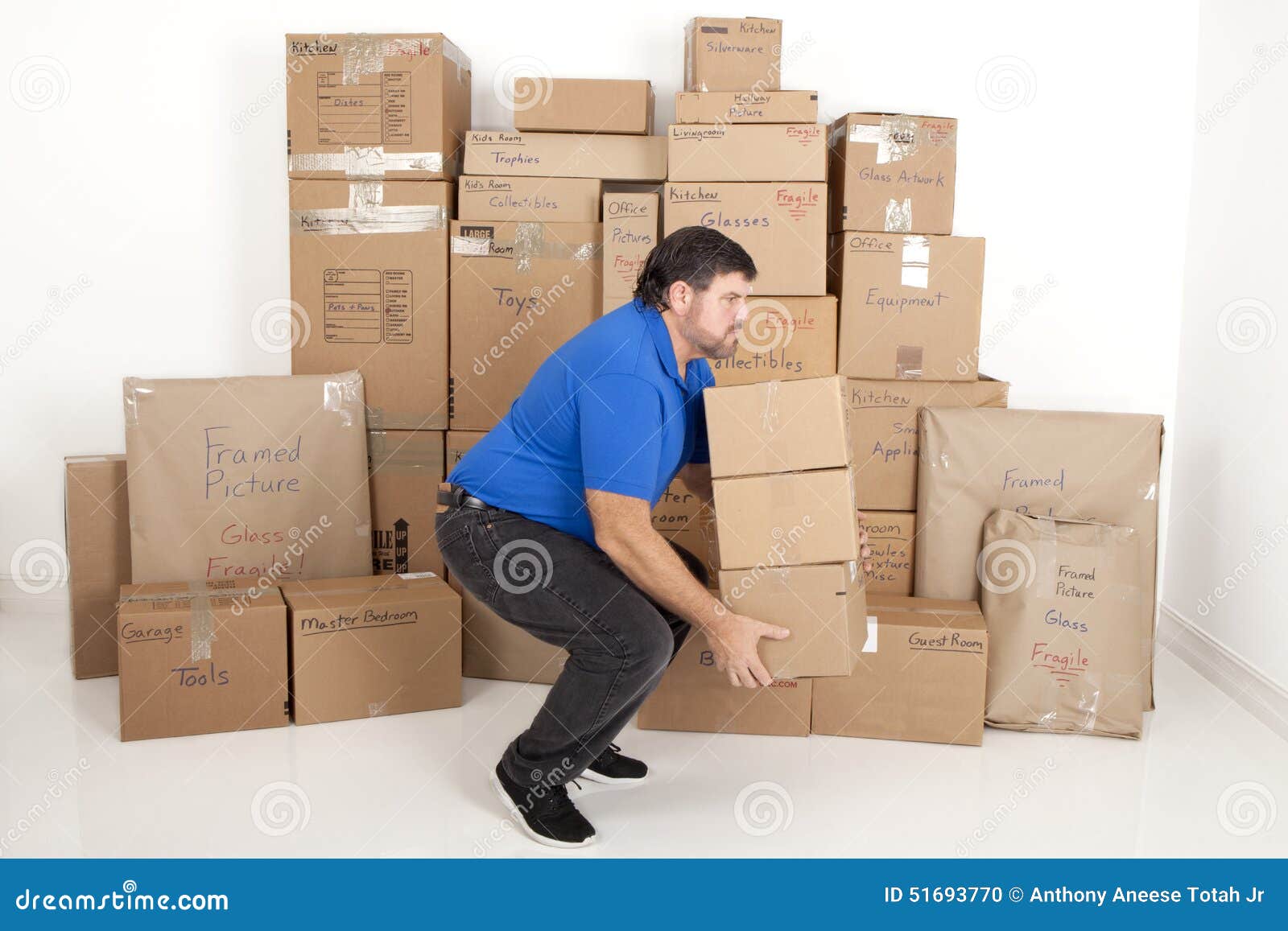 Man moving boxes. stock photo. Image of indoors, expression - 51693770
