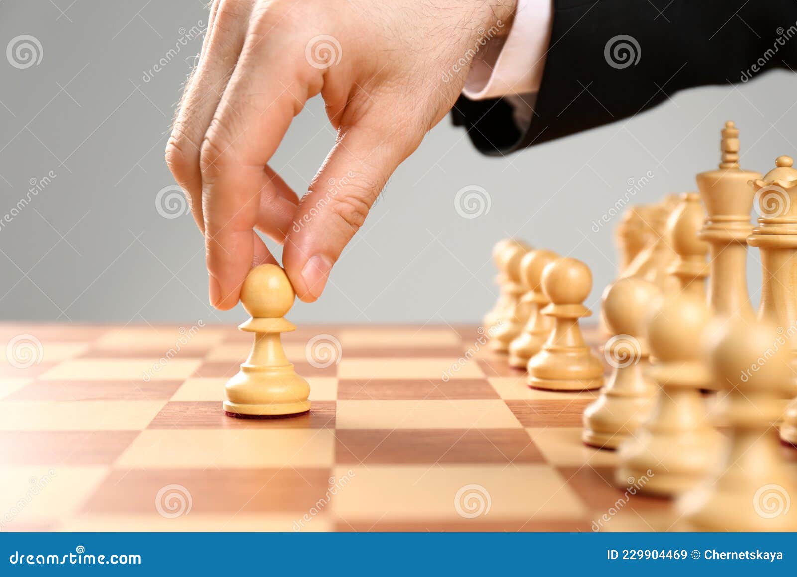 Man Moving Chess Piece on Board Stock Image - Image of game, hierarchy ...
