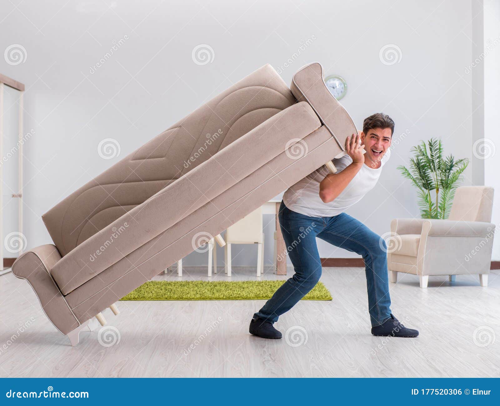 Man Moving Furniture at Home Stock Photo - Image of male, lifting ...