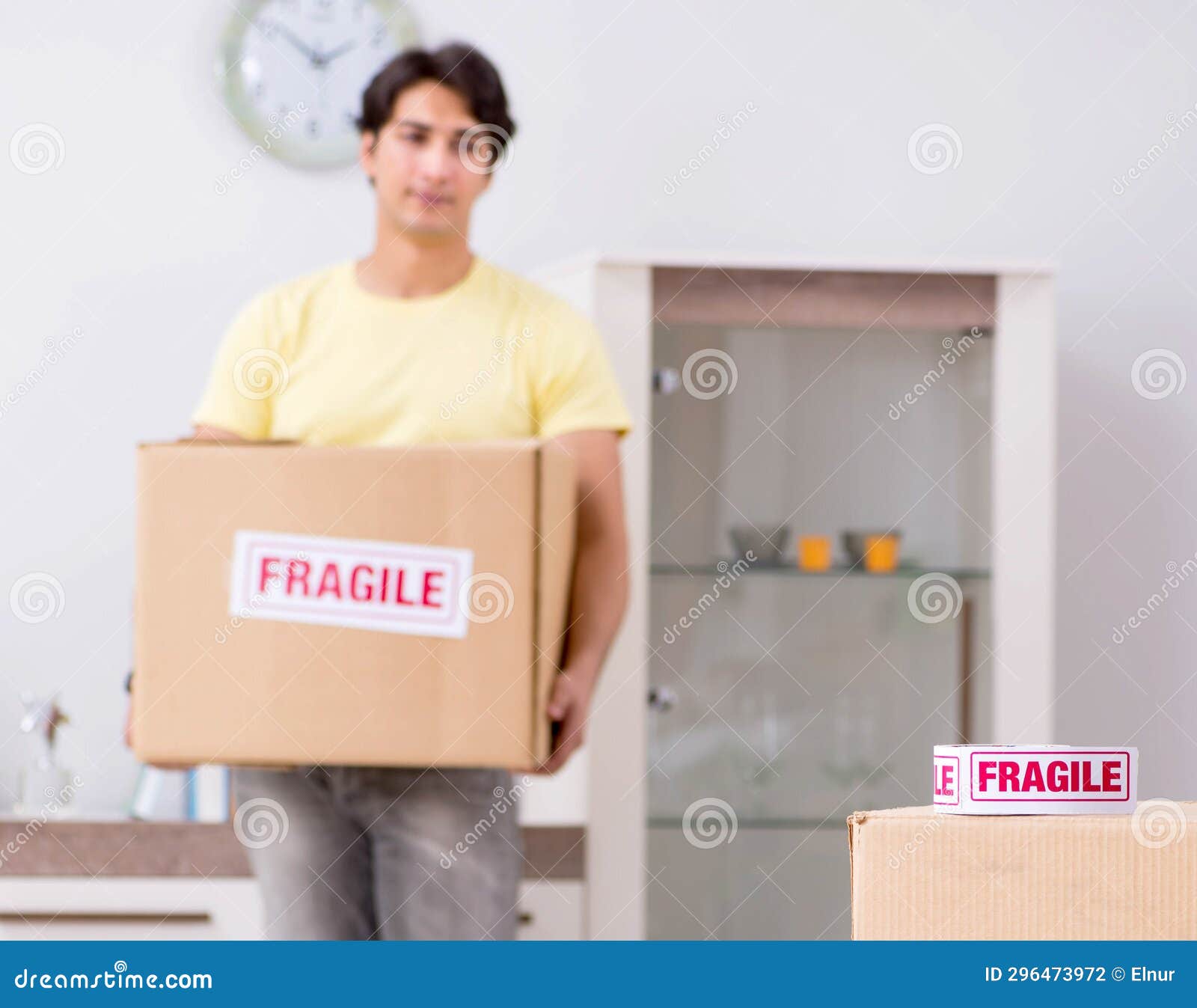 Man Moving House and Relocating with Fragile Items Stock Photo - Image ...