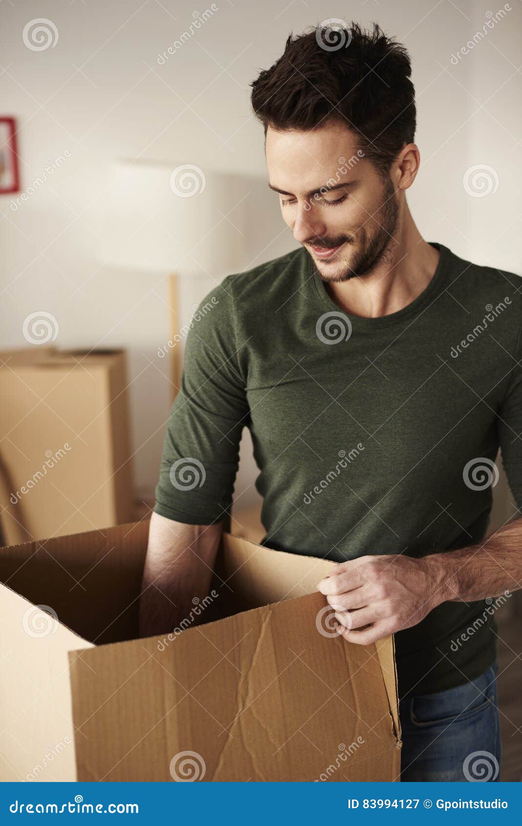 Man moving new home stock image. Image of improvement - 83994127