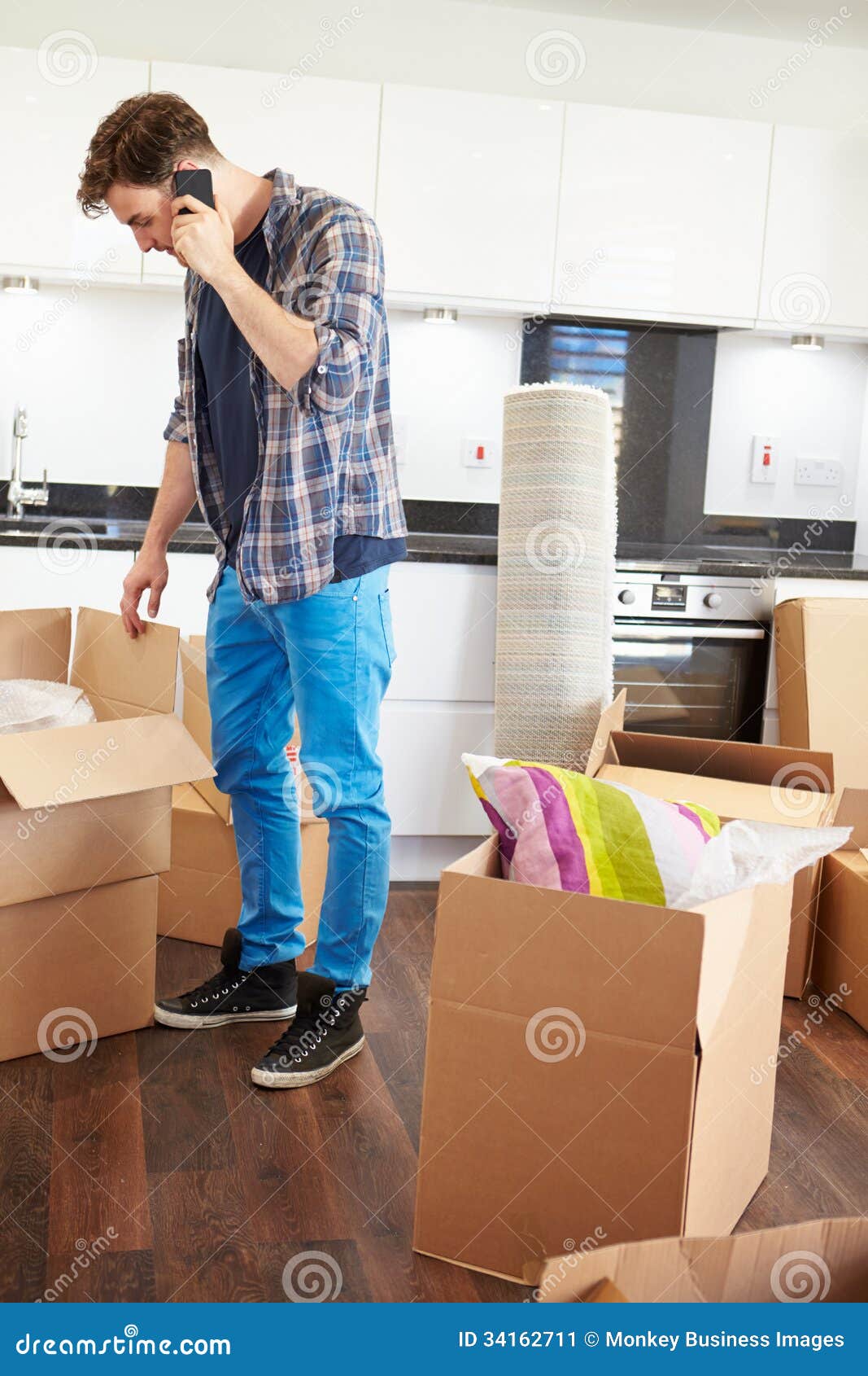 Man Moving into New Home Talking on Mobile Phone Stock Image - Image of ...