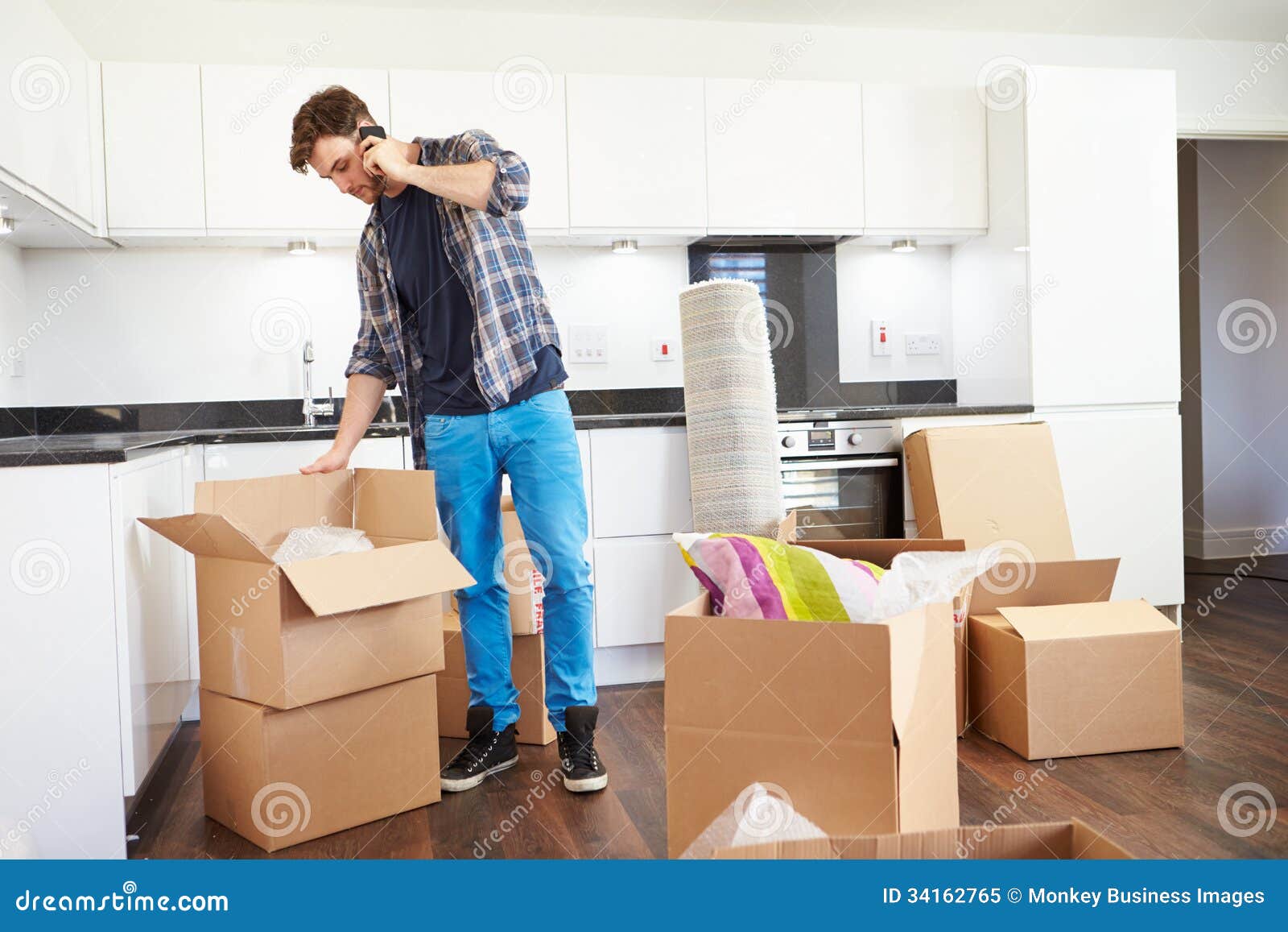 Man Moving into New Home Talking on Mobile Phone Stock Image - Image of ...