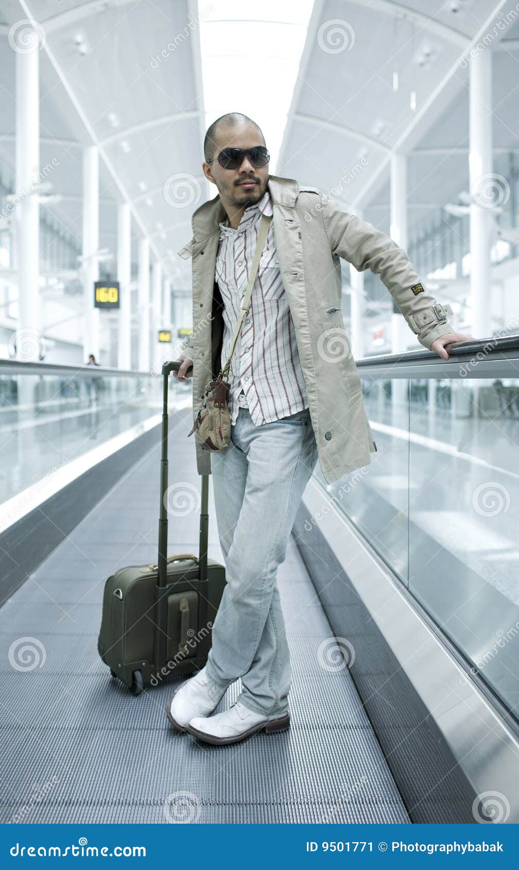 Man on moving walkway stock image. Image of tourist, carry - 9501771