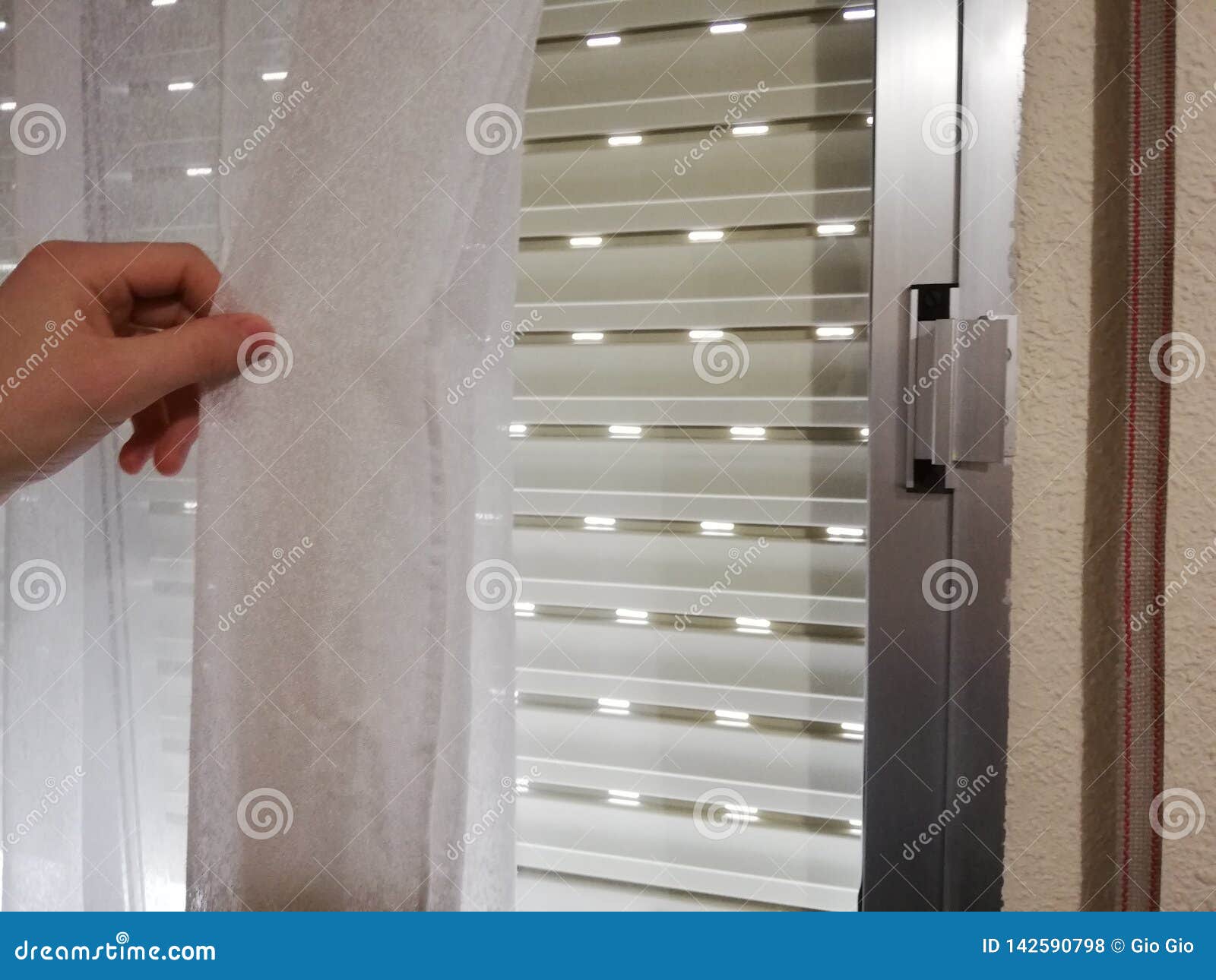 Man Moving Window Curtain, Showing Down Roller Shutter Stock Photo ...