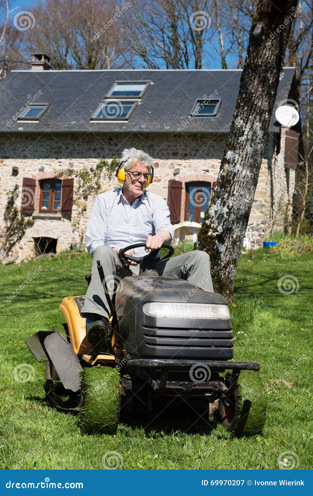 Man mowing the grass stock image. Image of person, typical - 69970207