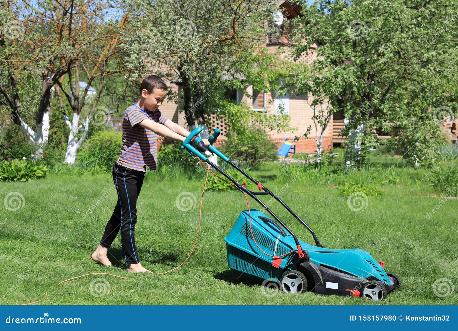 Man Mowing the Lawn with Lawnmower Stock Photo - Image of field, spring ...