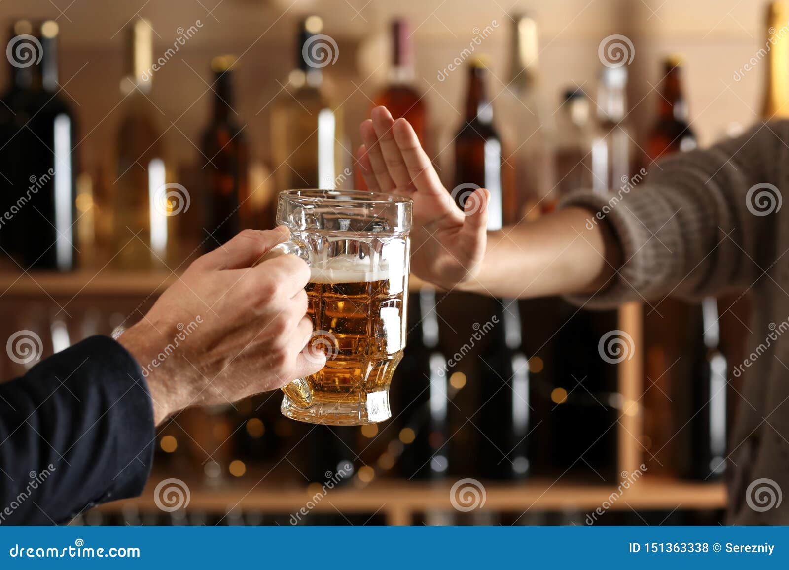 Man with Mug of Beer and Woman Refusing To Drink in Bar Stock Photo ...