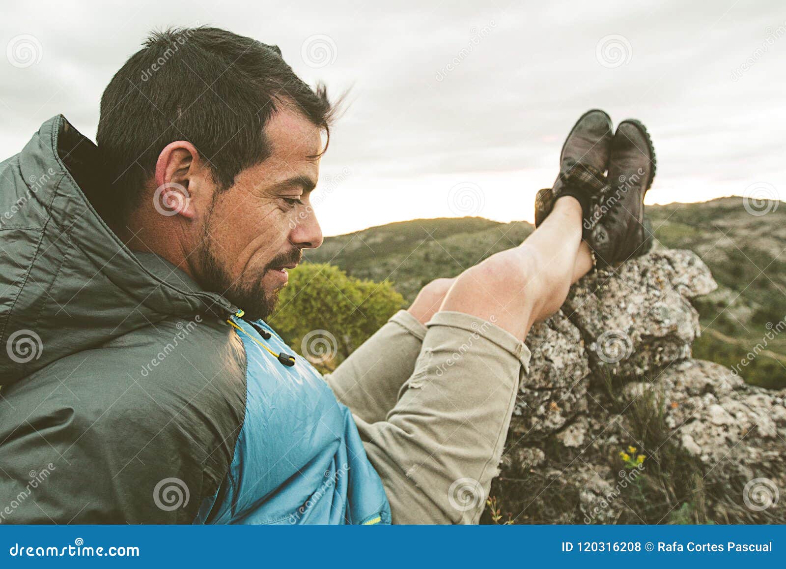 Man in Nature Relaxed and Seated. Guy Observing the Landscape in the ...