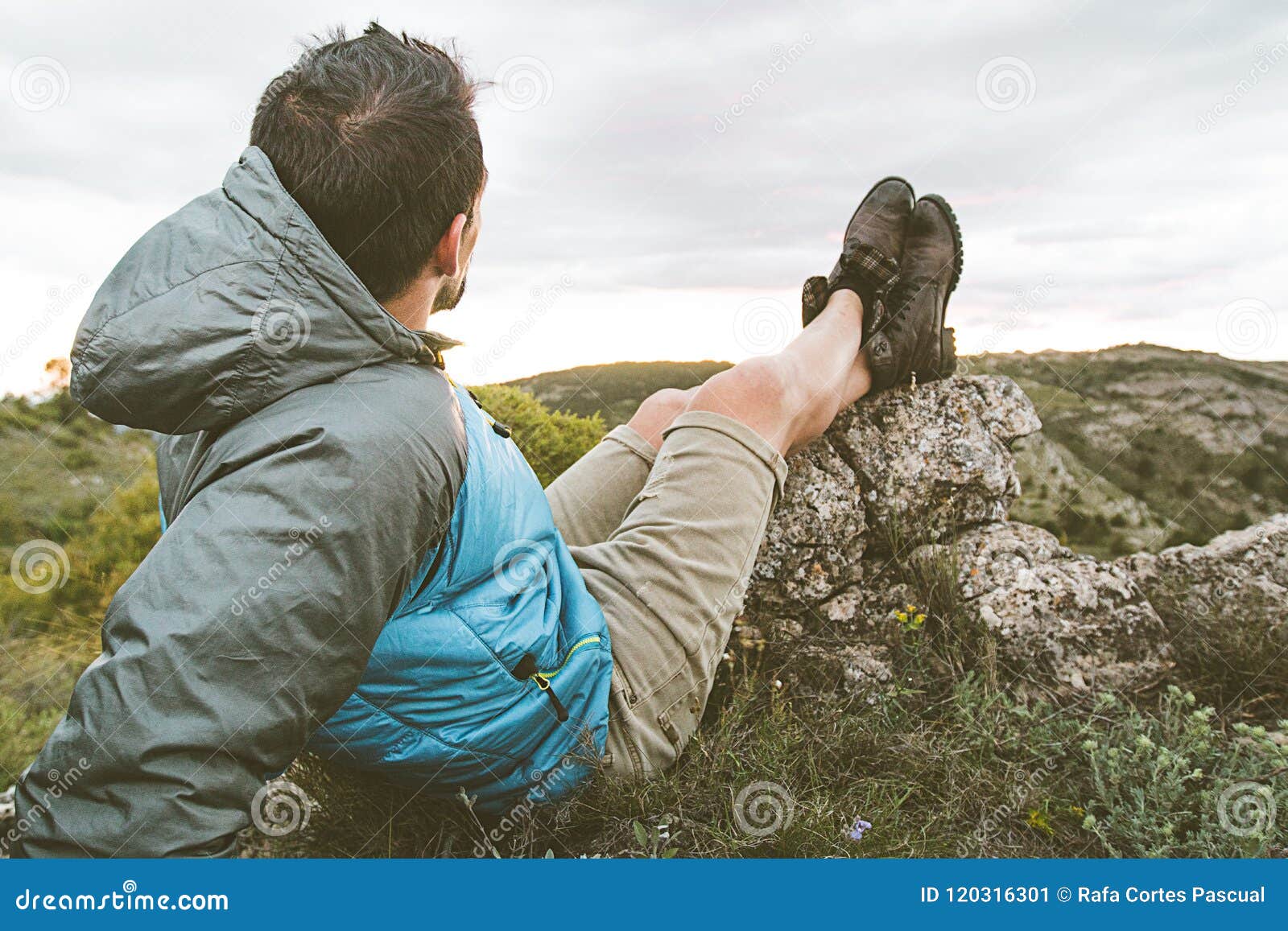 Man in Nature Relaxed and Seated. Guy Observing the Landscape in the ...