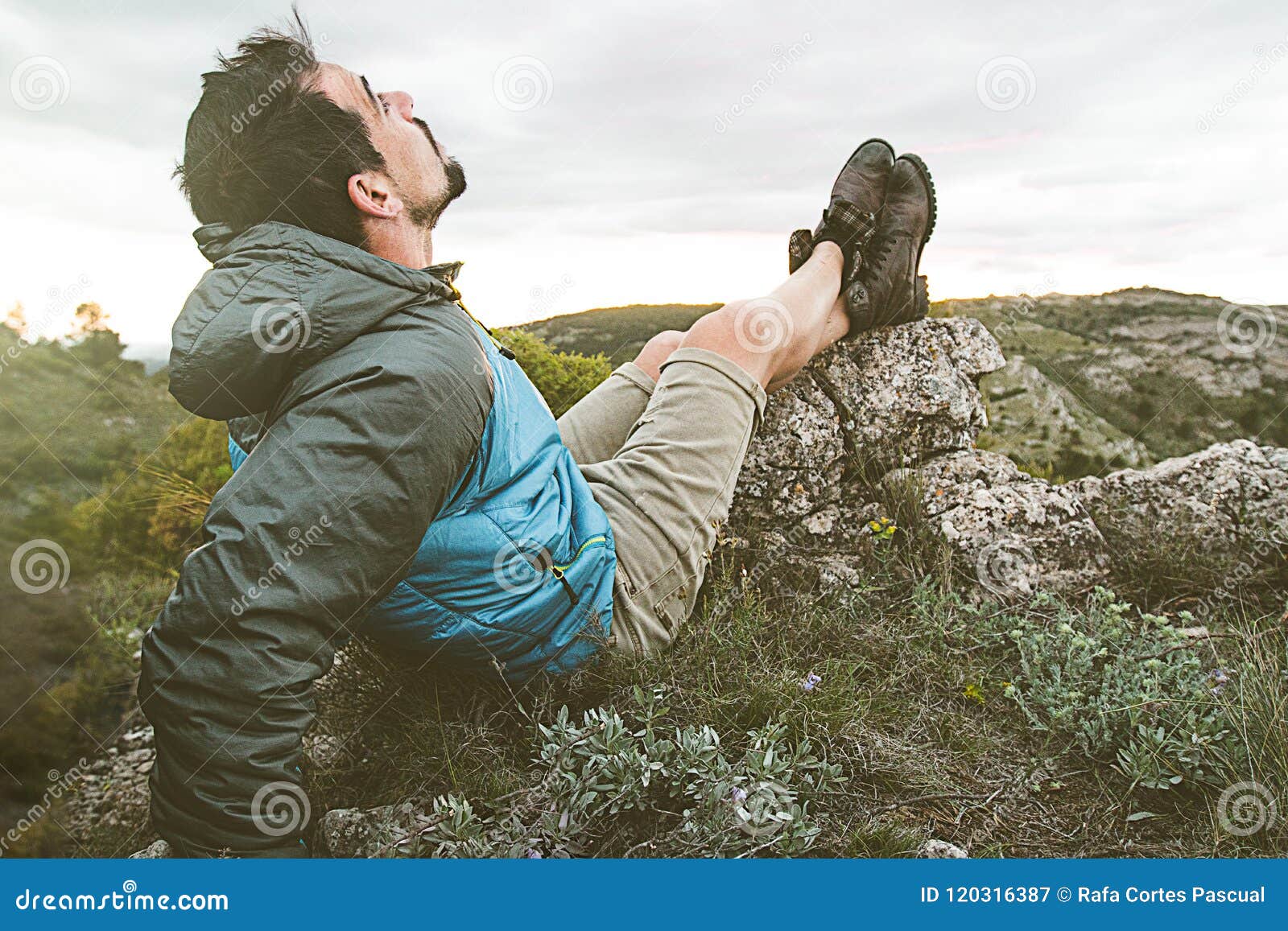 Man in Nature Relaxed and Seated. Guy Observing the Landscape in the ...