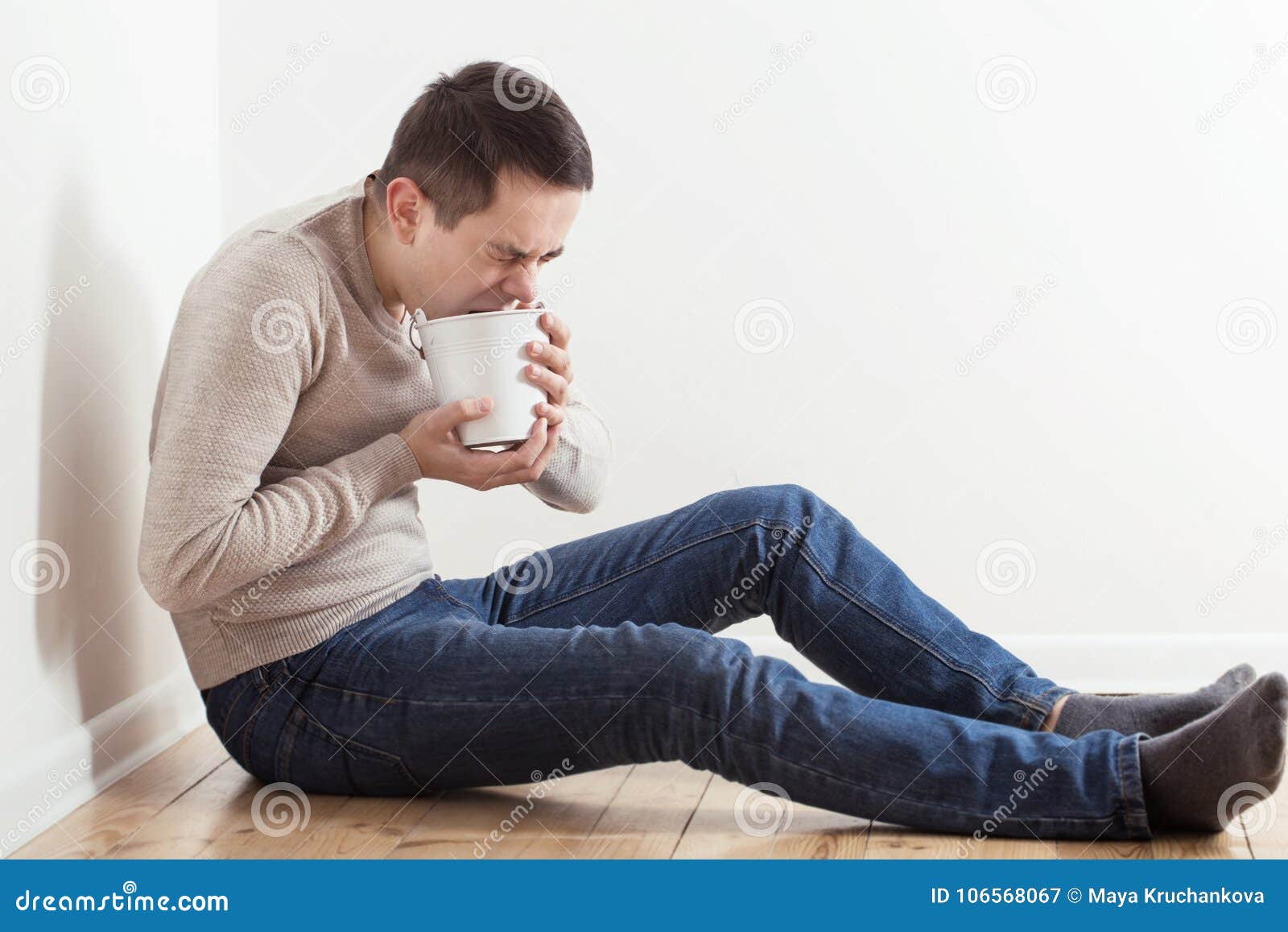 Man with nausea on floor stock image. Image of hangover - 106568067