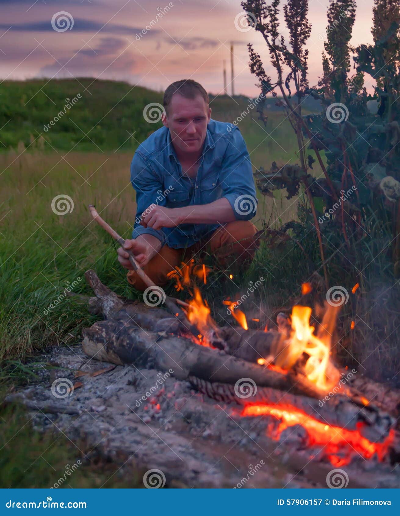 Man near bonfire in nature stock image. Image of bonfire - 57906157