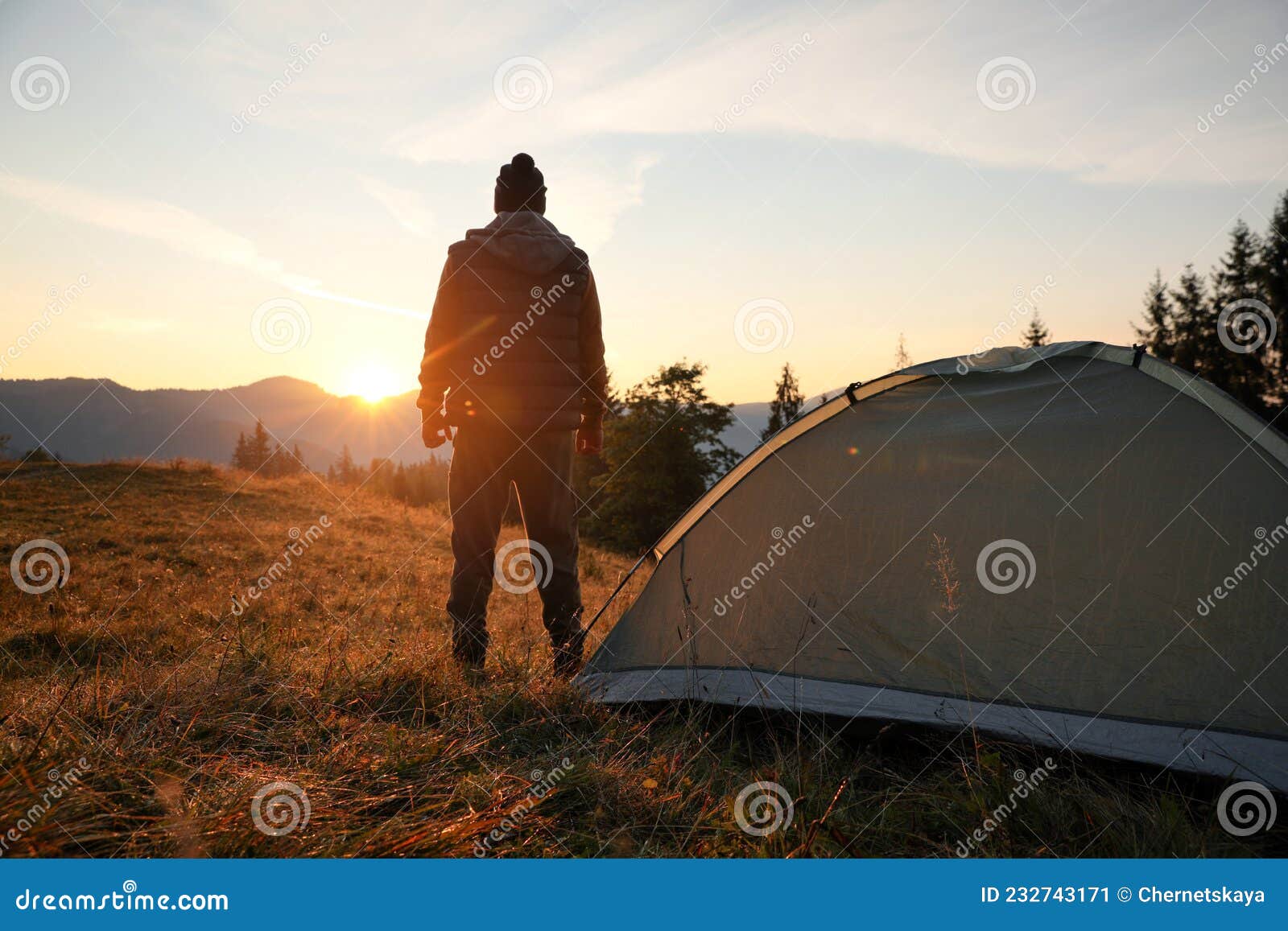 Man Near Camping Tent in Mountains at Sunset, Back View Stock Image ...
