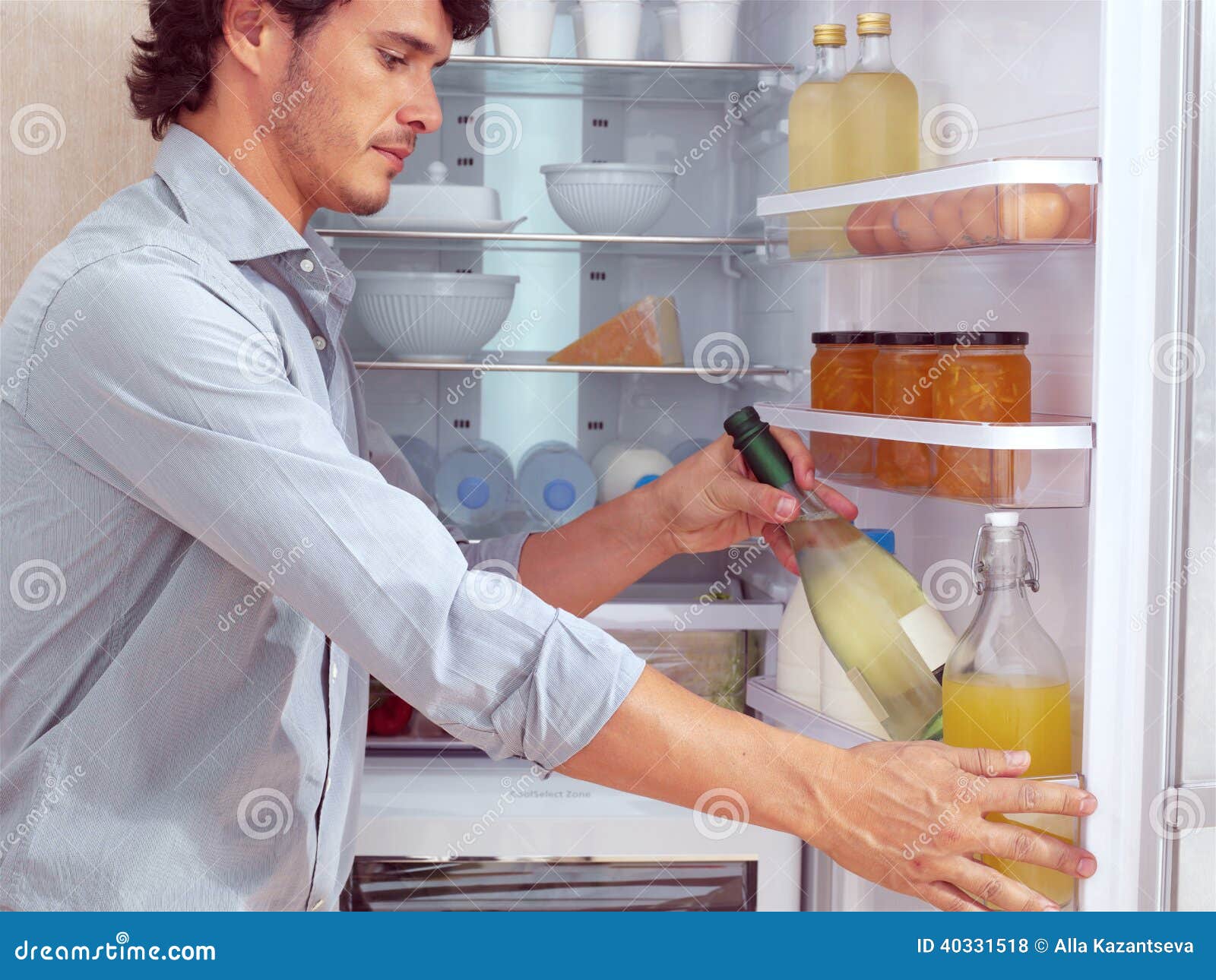 Man Near Refrigerator With To Do List On Door In Kitchen Stock ...